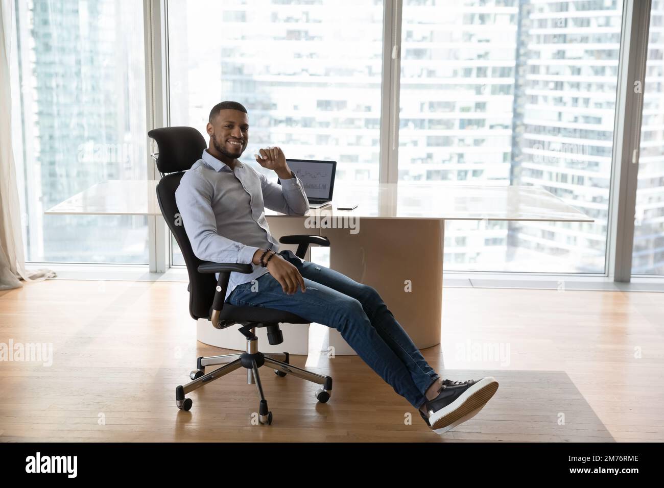 African businessman, sales manager, financial analyst pose at workplace ...