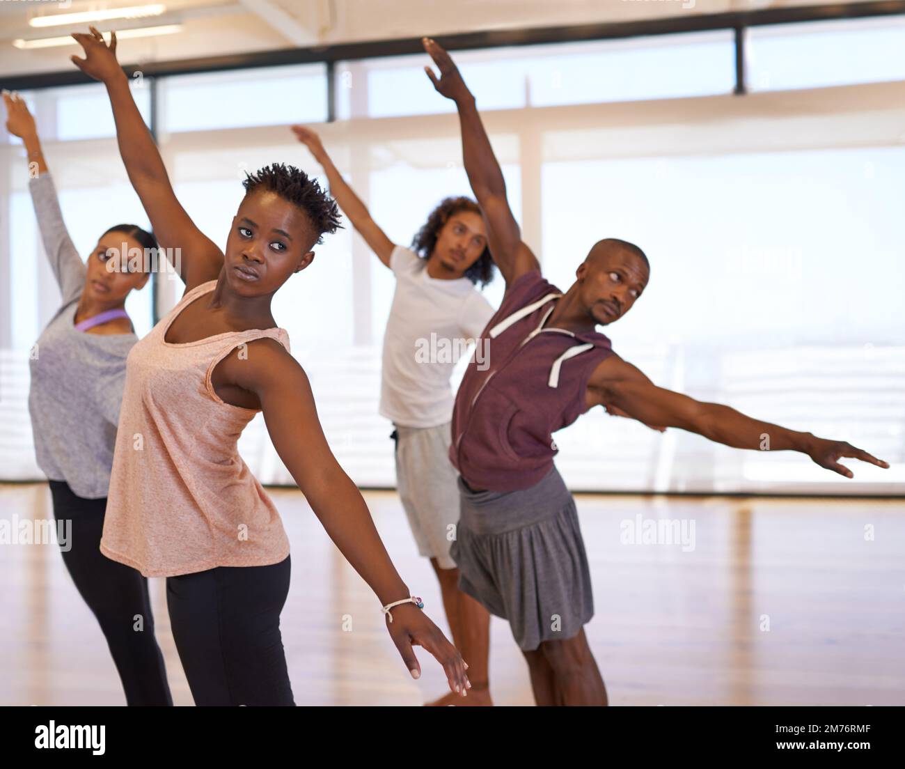 Rocking their recital. a group of young dancers rehearsing together in ...
