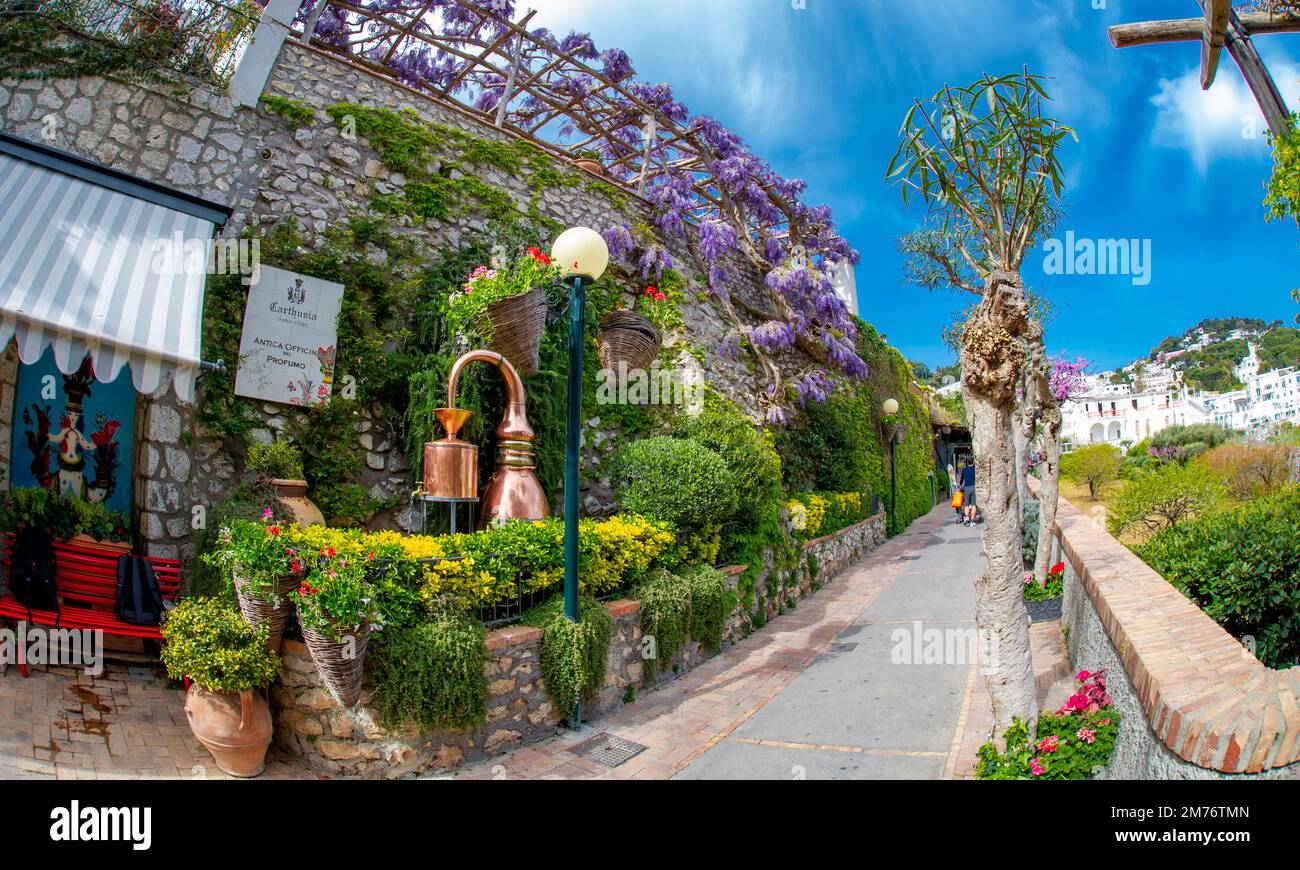 APRIL 23 2022 - Capri Italy entrance to a perfume shop, in front are ...