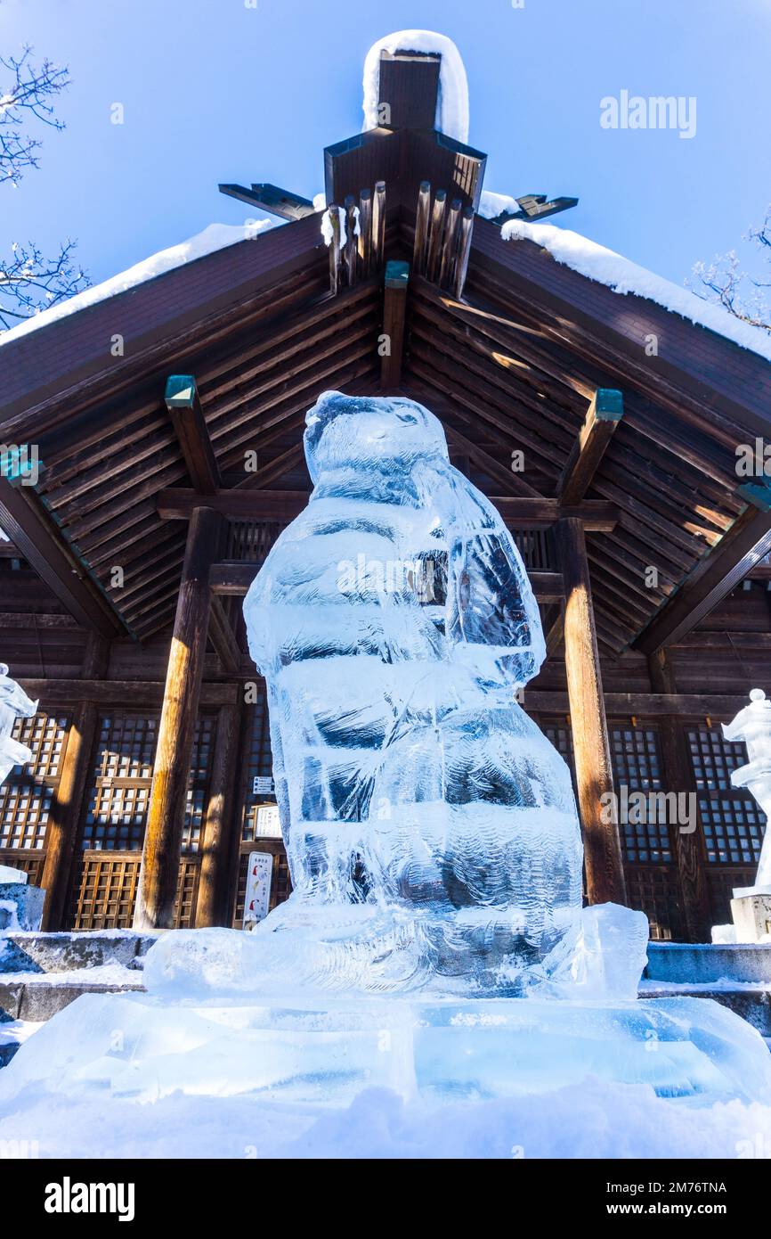 Ice sculpture of a rabbit in the sunshine at Higashikawa Shrine at New ...