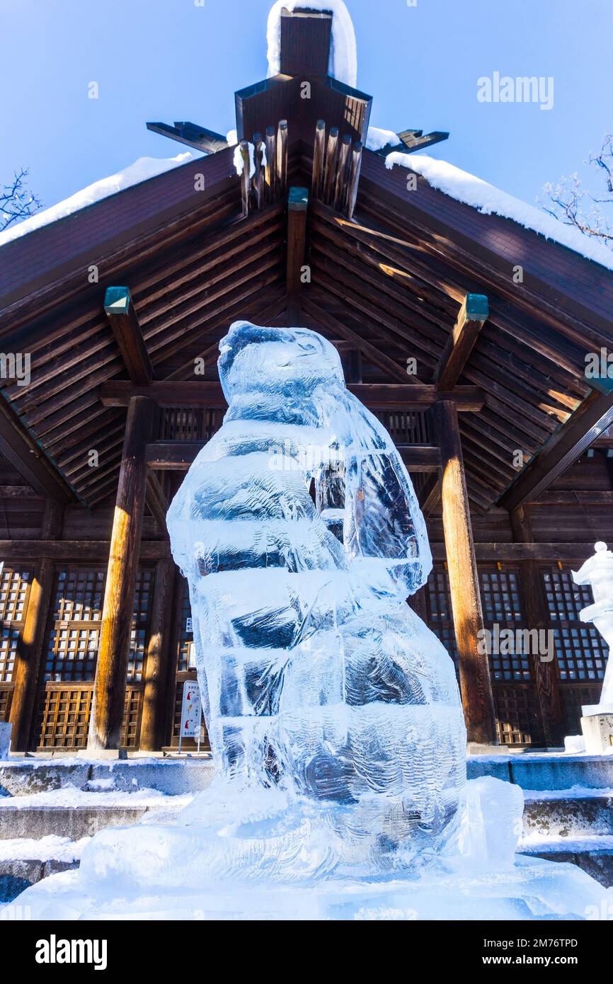 Ice sculpture of a rabbit in the sunshine at Higashikawa Shrine at New ...