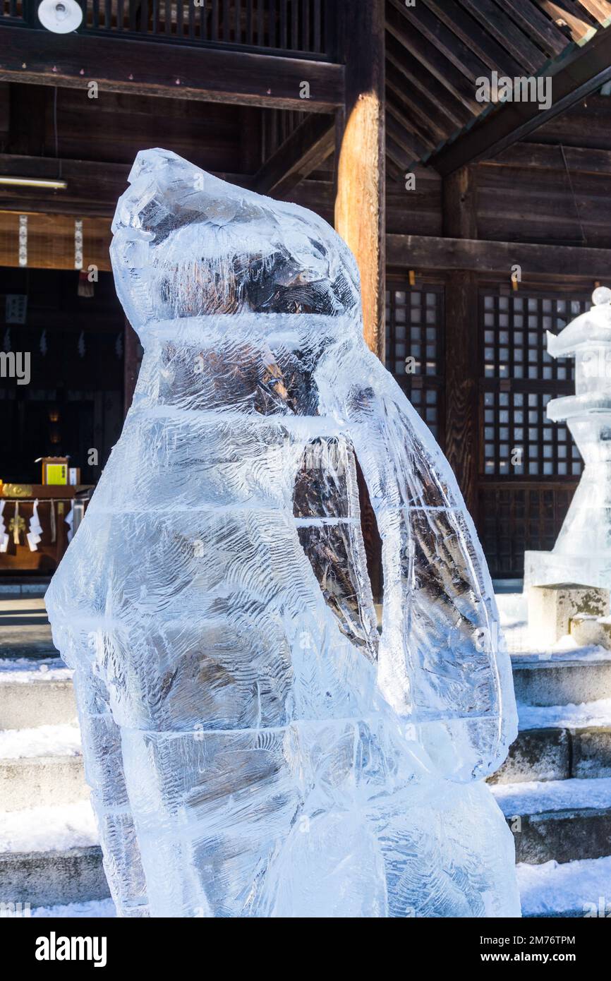 Ice sculpture of a rabbit in the sunshine at Higashikawa Shrine at New ...