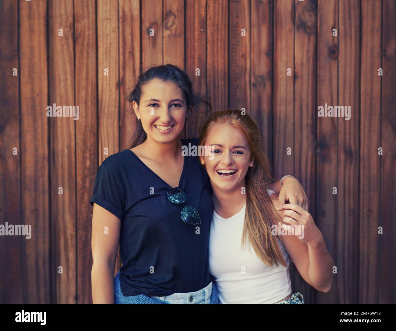 Our girlfriends are our real soulmates...Two teenage friends holding ...