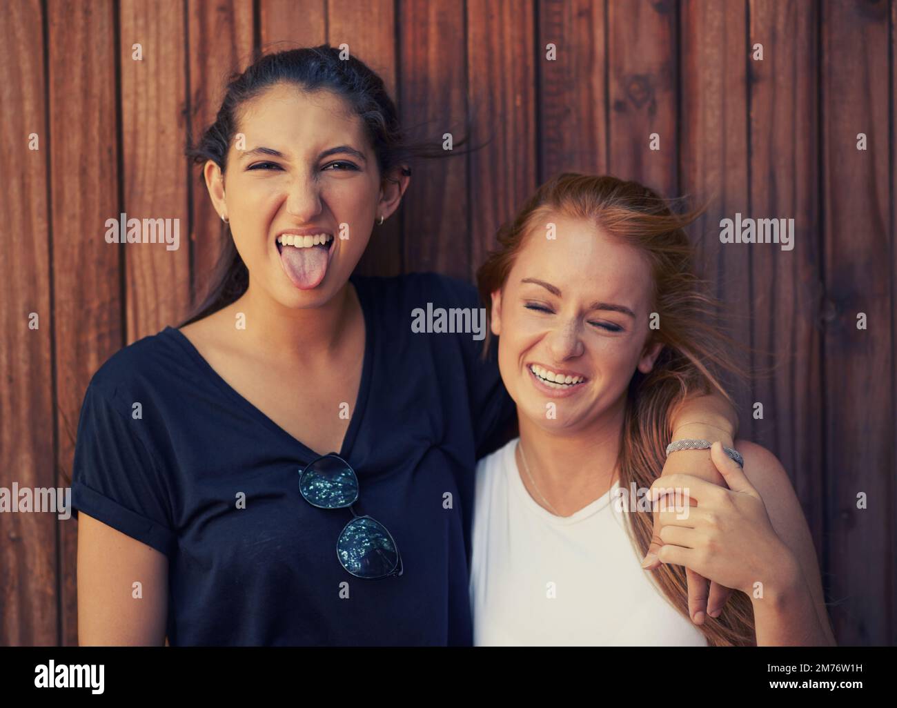 True friends can act the fool together. Two beautiful young girls ...