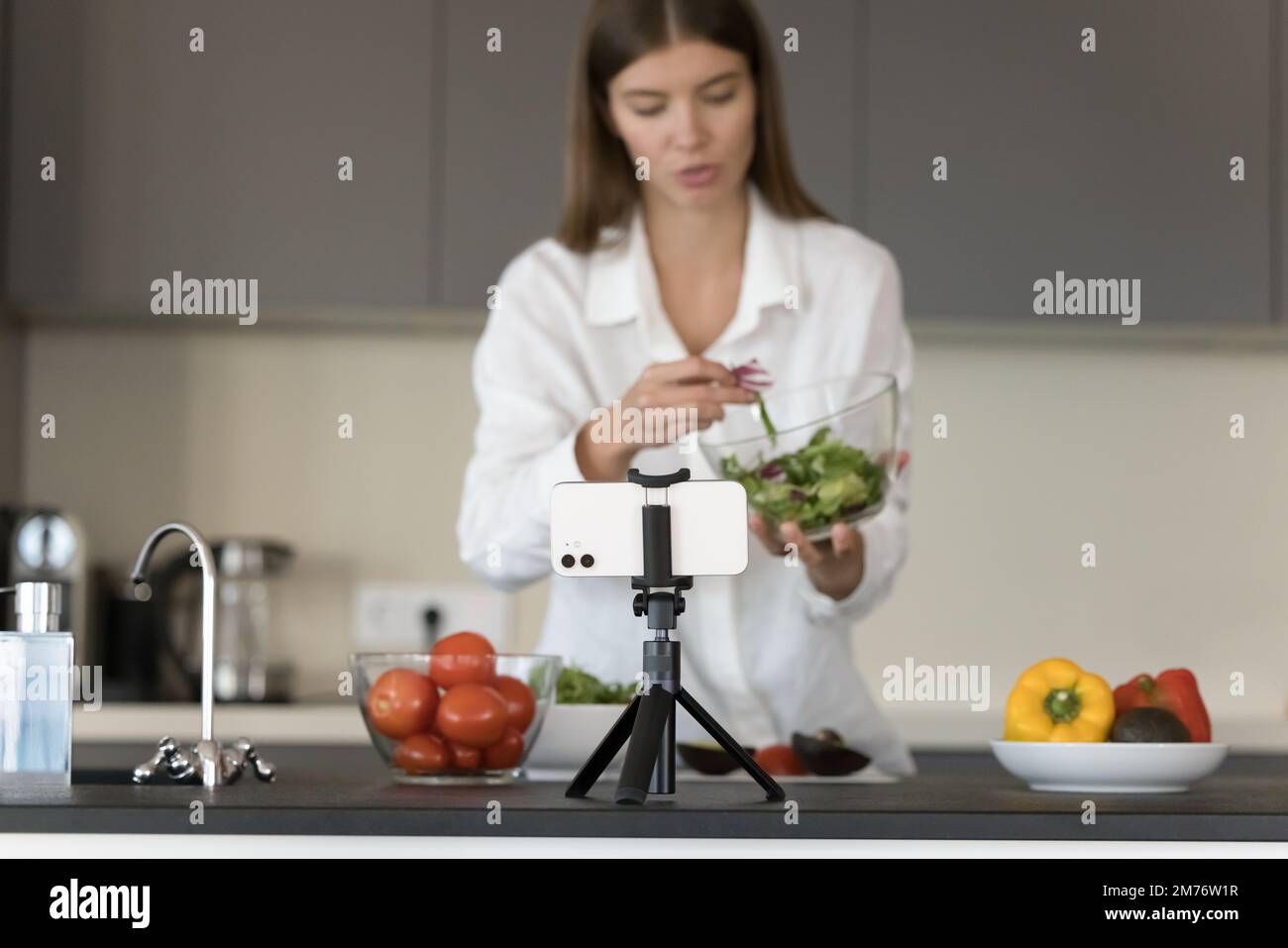 Woman vlogger cooking and recording food vlog for social media Stock ...