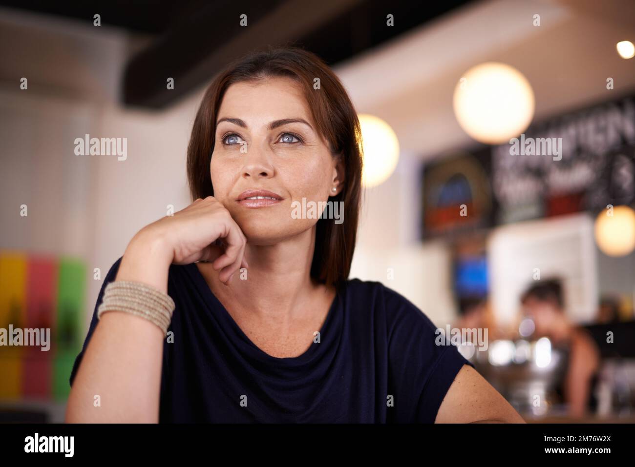 My favorite place to daydream. An attractive woman deep in thought at a ...