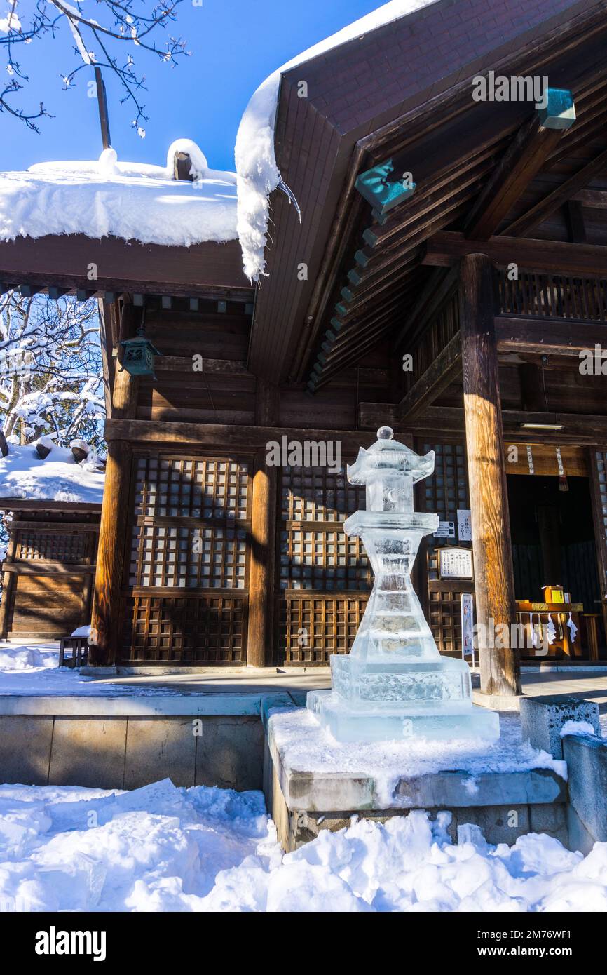 Ice sculpture of a toro Japanese stone lantern outside Higashikawa ...
