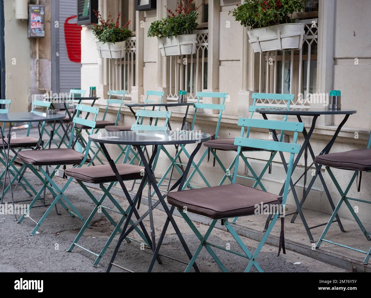 Empty table in outdoor cafe or restaurant. Tables and chairs at ...