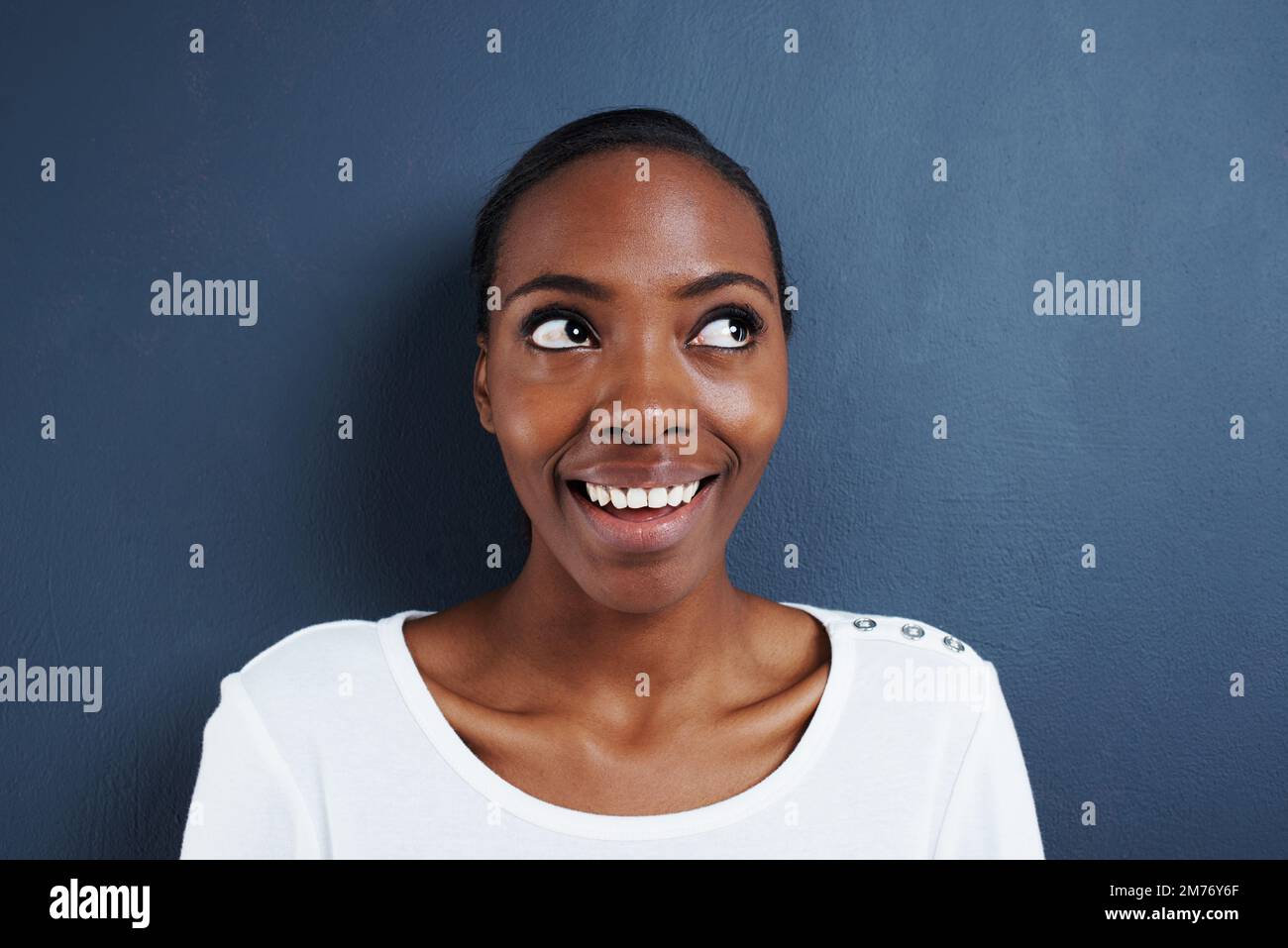 That made her look twice. an attractive young woman smiling while ...