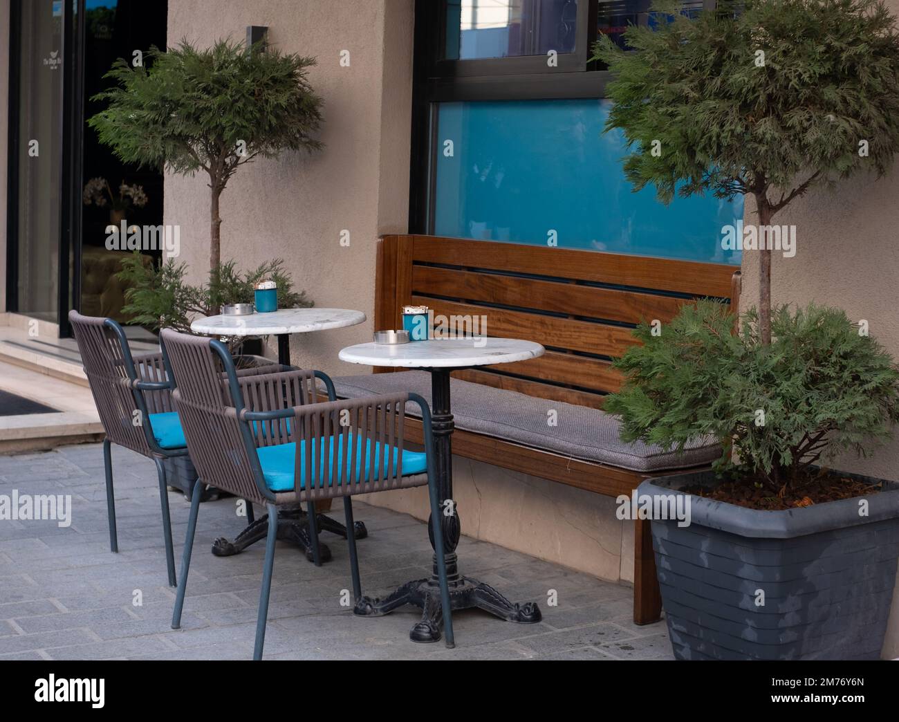 Empty table in outdoor cafe or restaurant. Tables and chairs at ...
