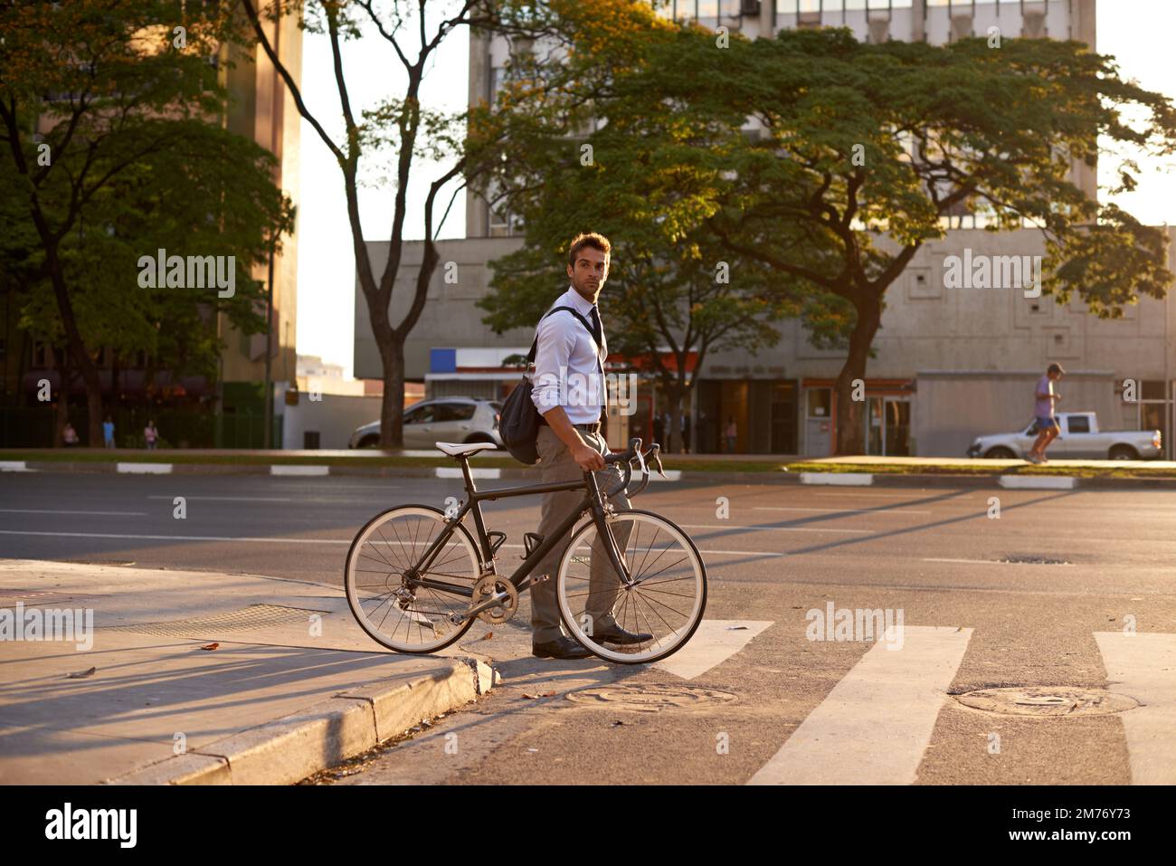 Getting around the green way. a businessman commuting to work with his ...