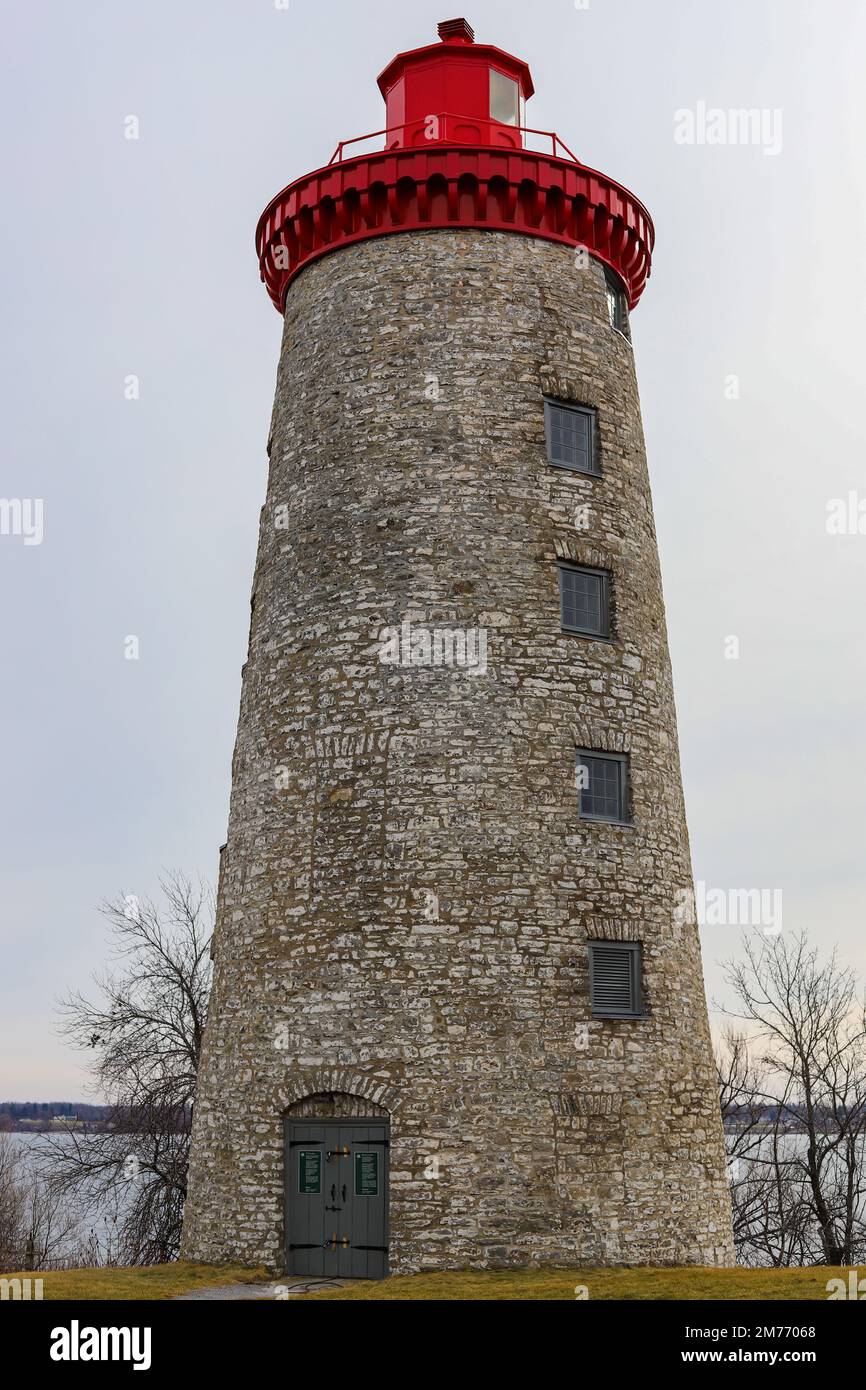 Old lighthouse - stone brick building with red roof windows and door ...