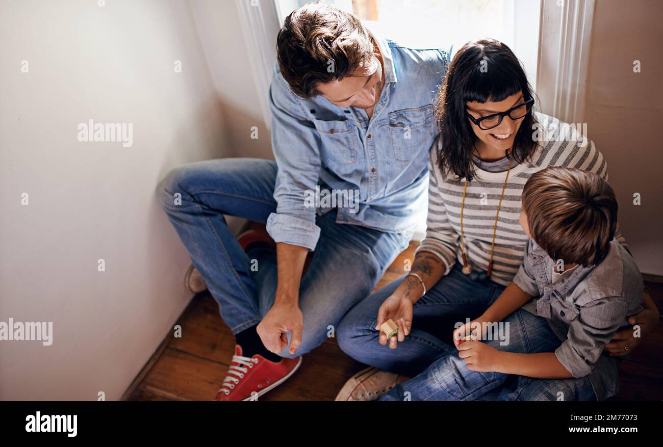 Mommy and daddy will always love you. a young family relaxing together ...