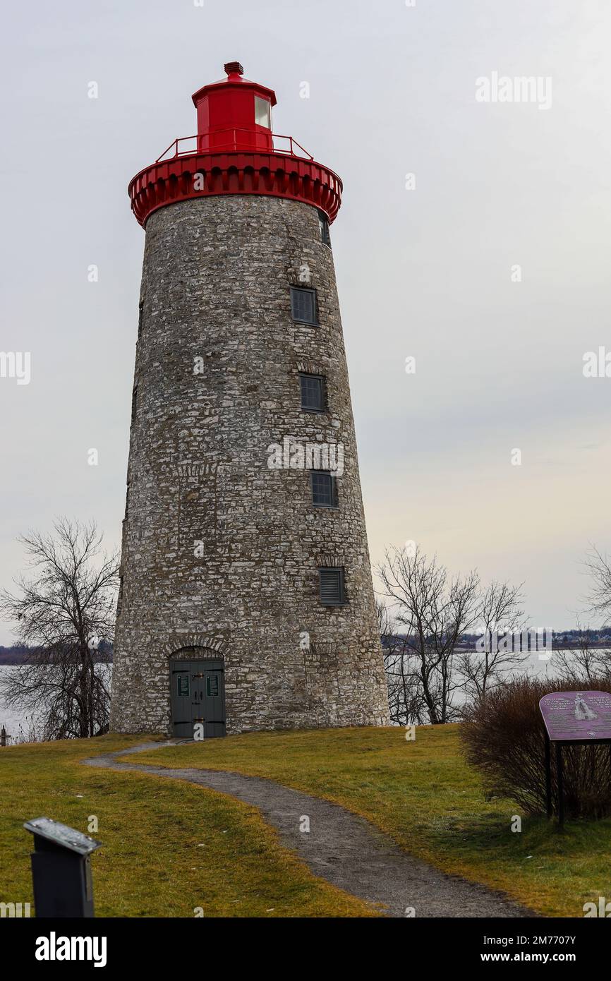 Old lighthouse - stone brick building with red roof windows and door ...