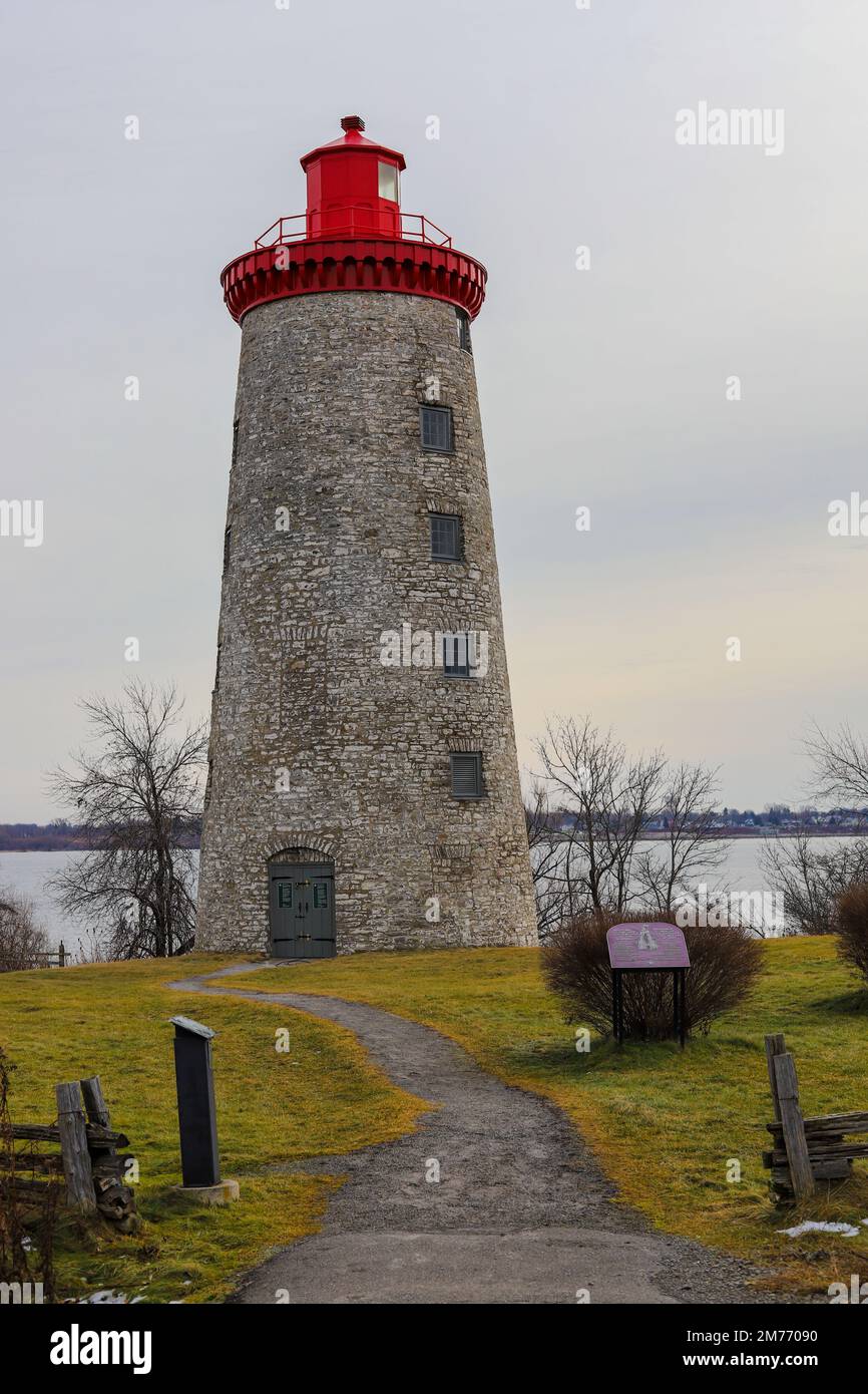 Old lighthouse - stone brick building with red roof windows and door ...