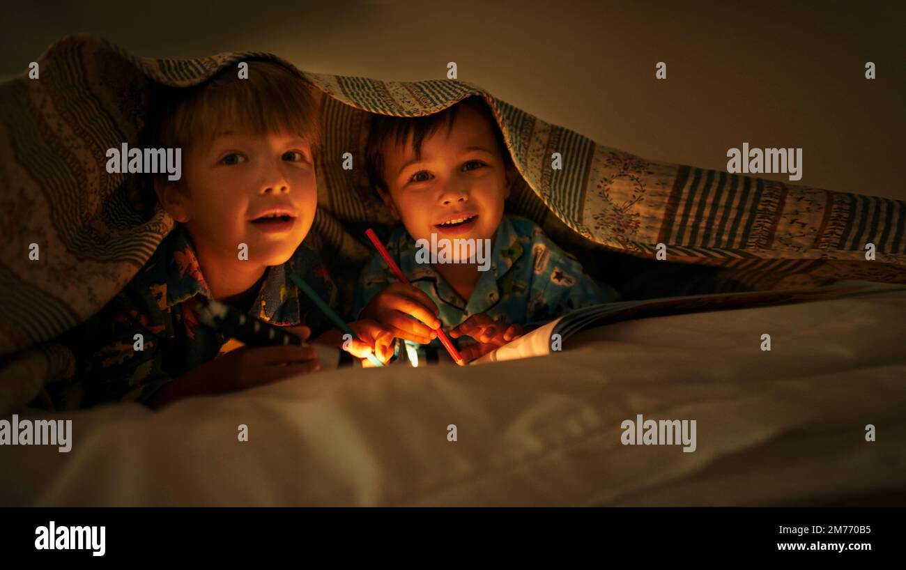 Just five more minutes. Two young brothers coloring in pictures while ...