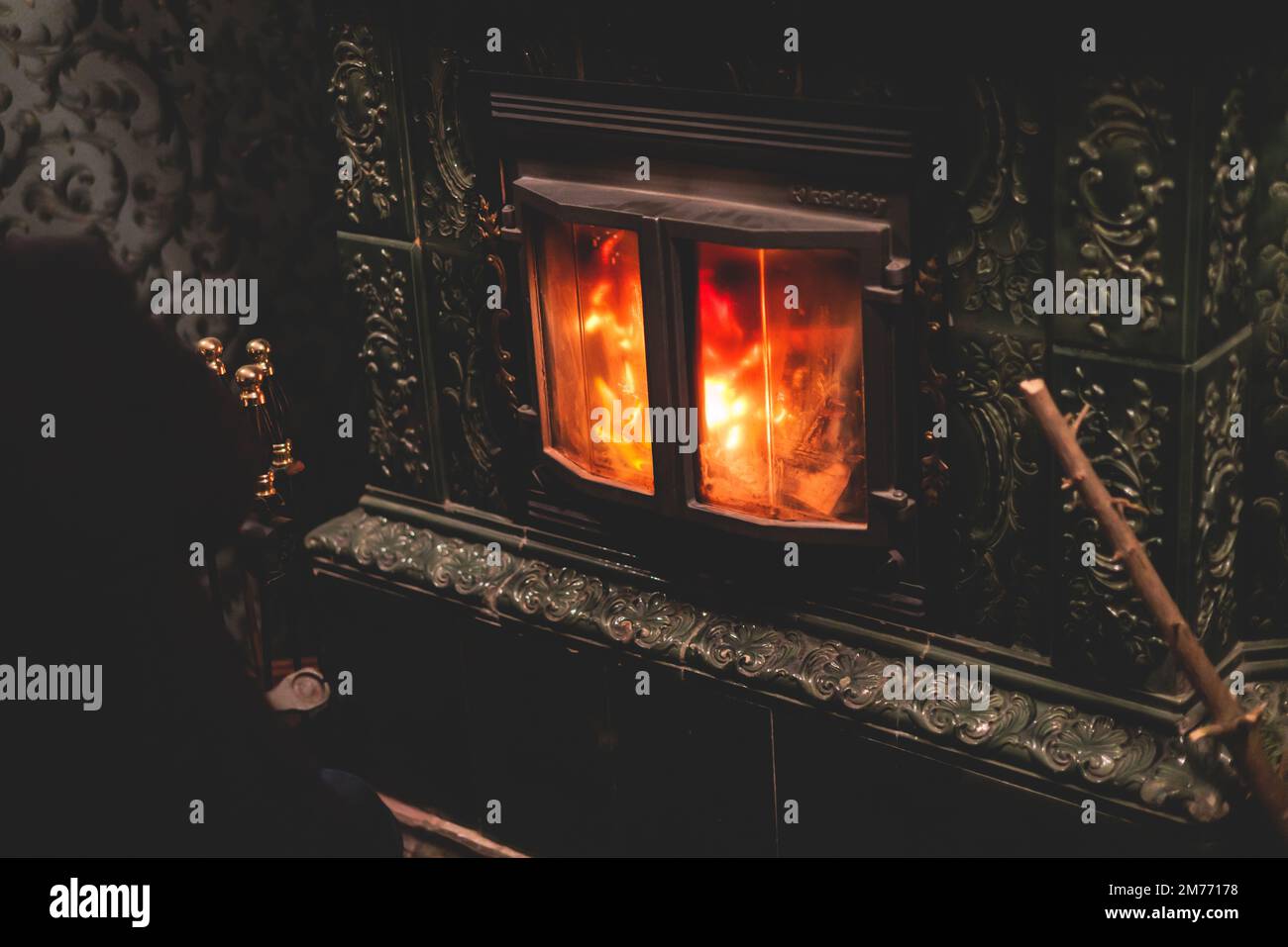 Warming up by the fire, cozy winter night in the cabin house by the ...