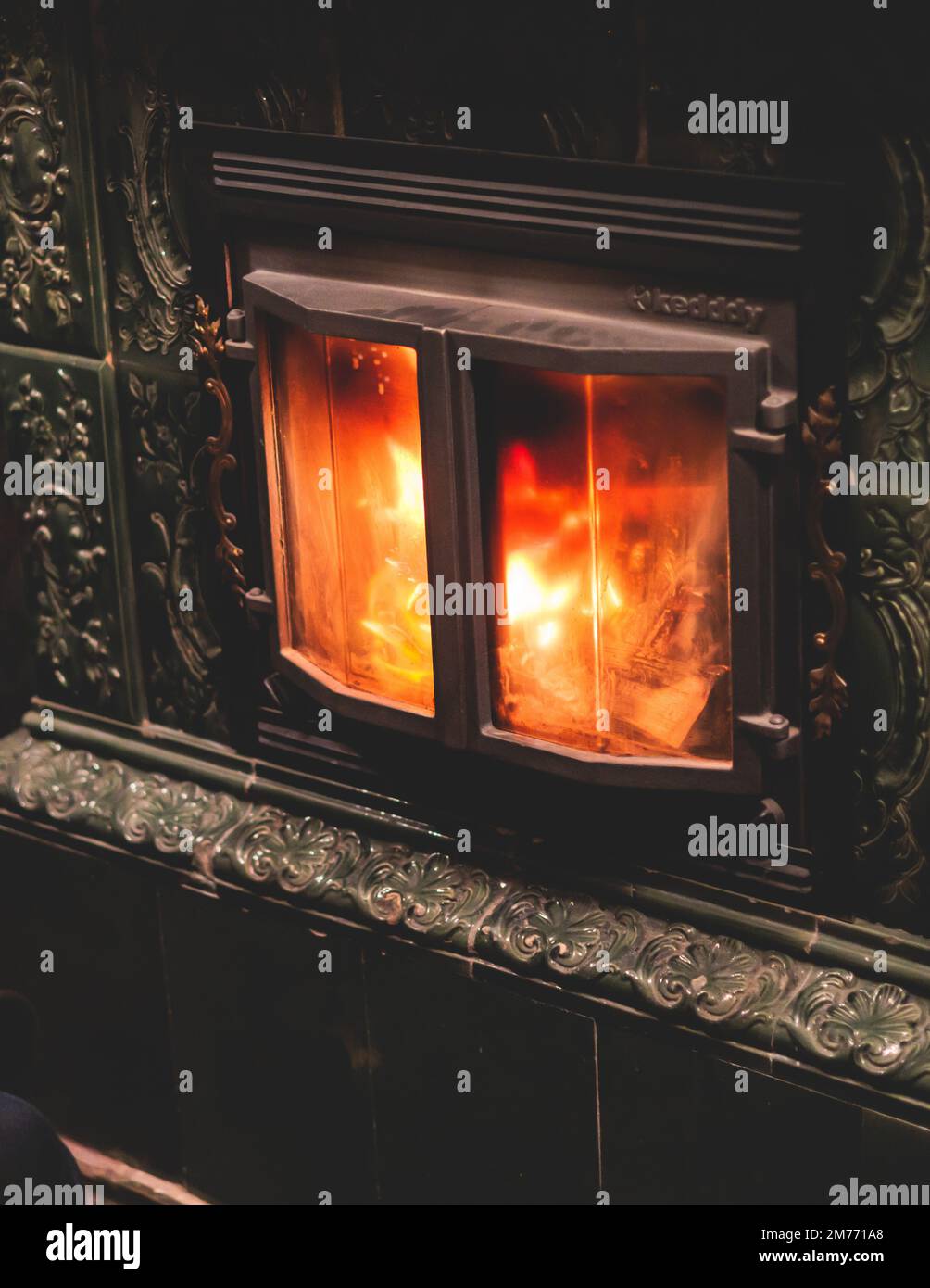 Warming up by the fire, cozy winter night in the cabin house by the ...