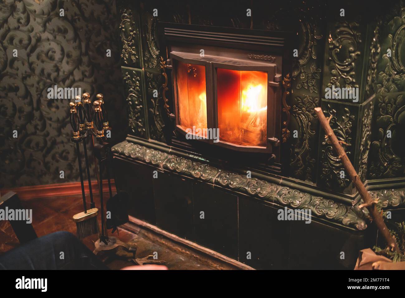 Warming up by the fire, cozy winter night in the cabin house by the ...