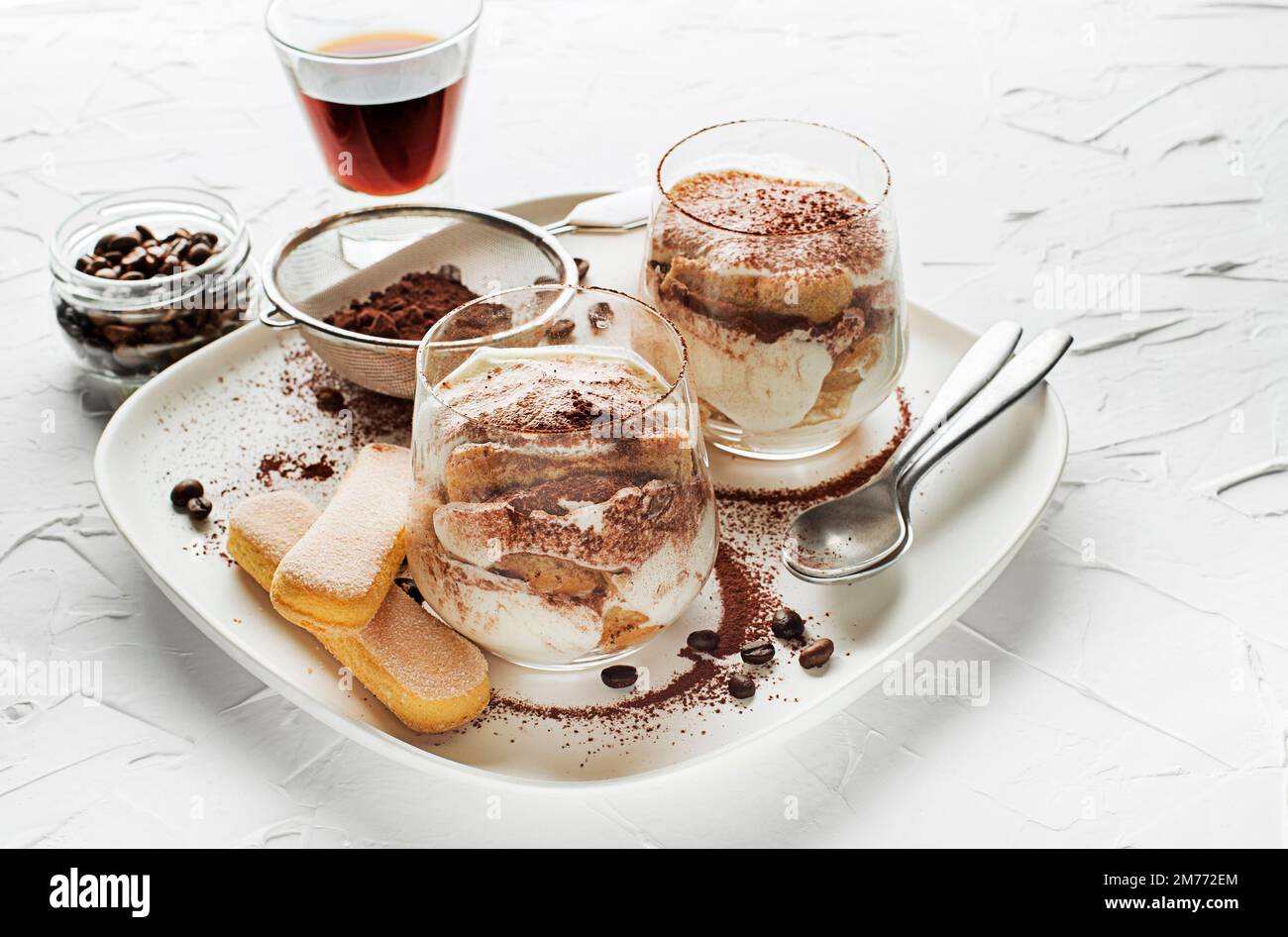 Traditional Italian dessert tiramisu in a glass cup. Homemade tiramisu ...