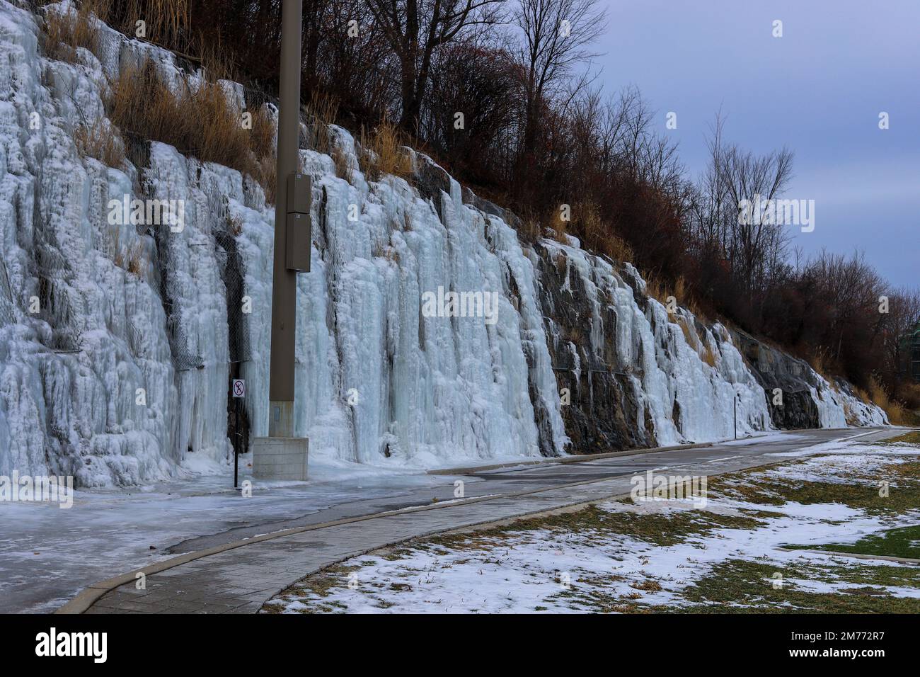 Beautiful ice structures of a frozen waterfall, pretty icicles forming ...