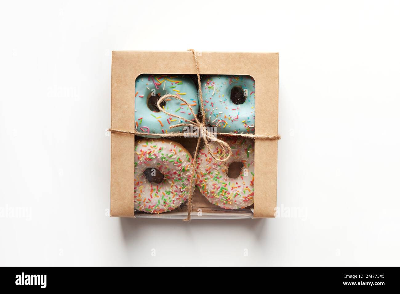 White and Blue sprinkled glazed donuts packed in box isolated on white ...