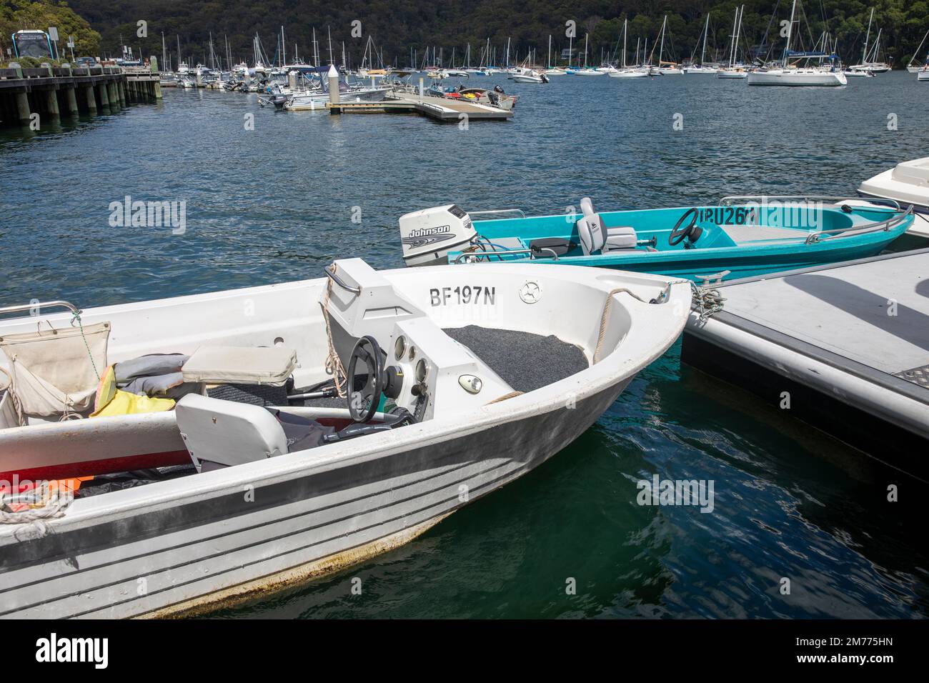 Small commuter boats berthed at Church Point Commuter wharf, on ...