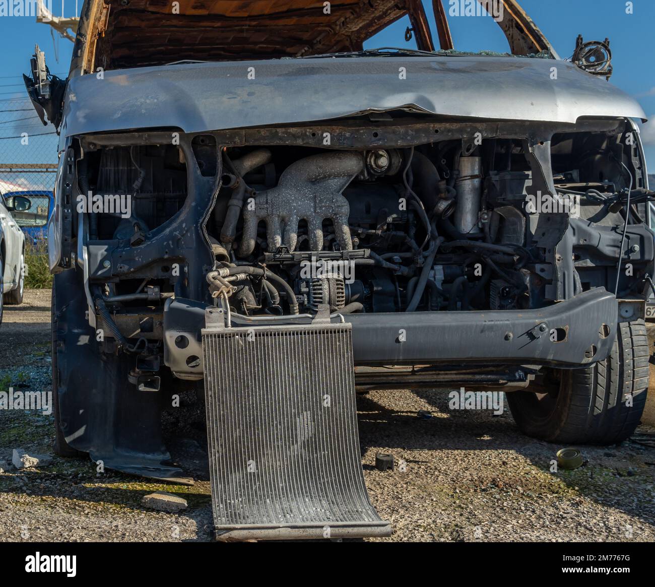Abandoned old van in a state of ruin after having been burned ...