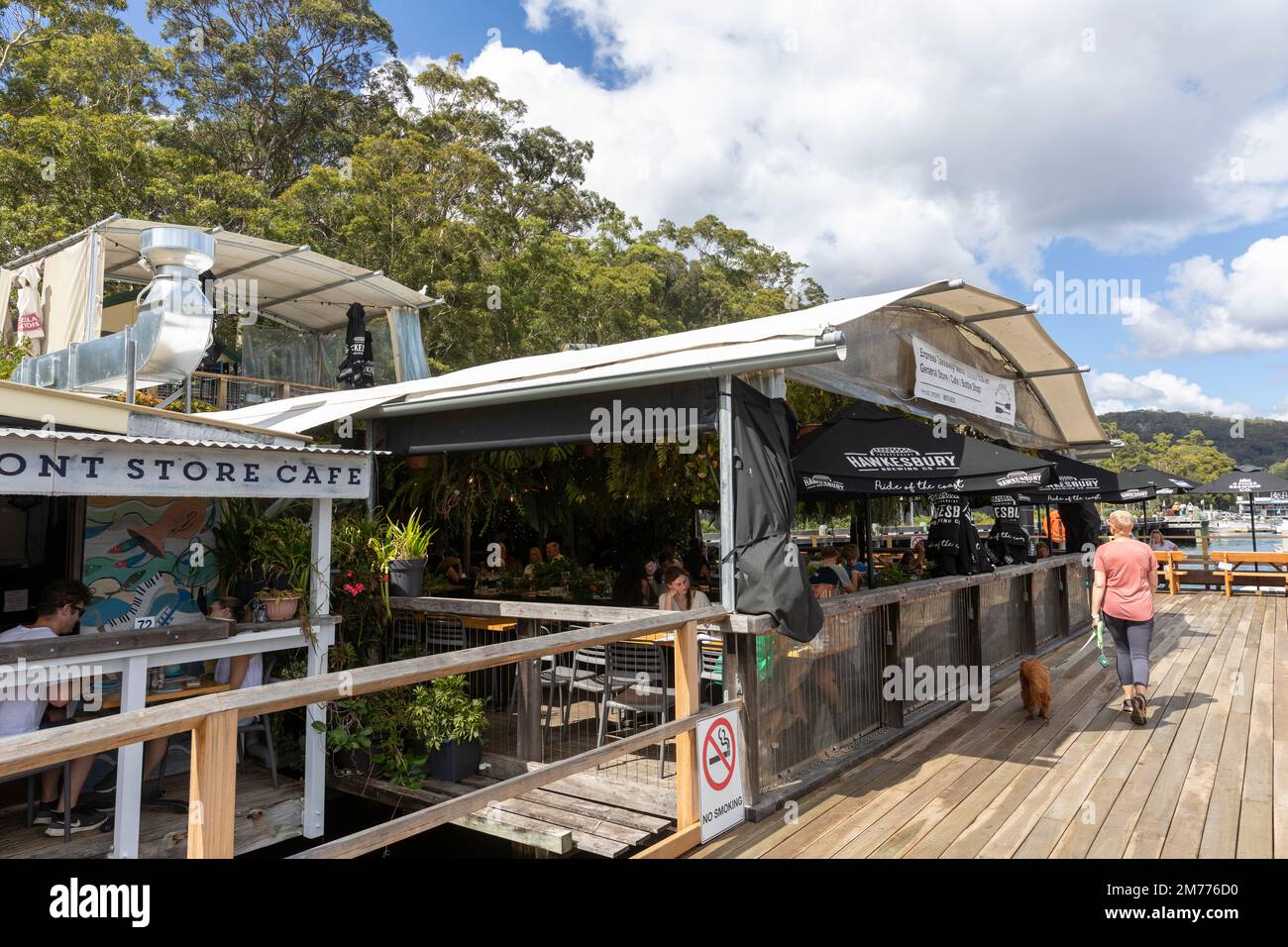 Church Point suburb in Sydney woman lady walking her dog past ...
