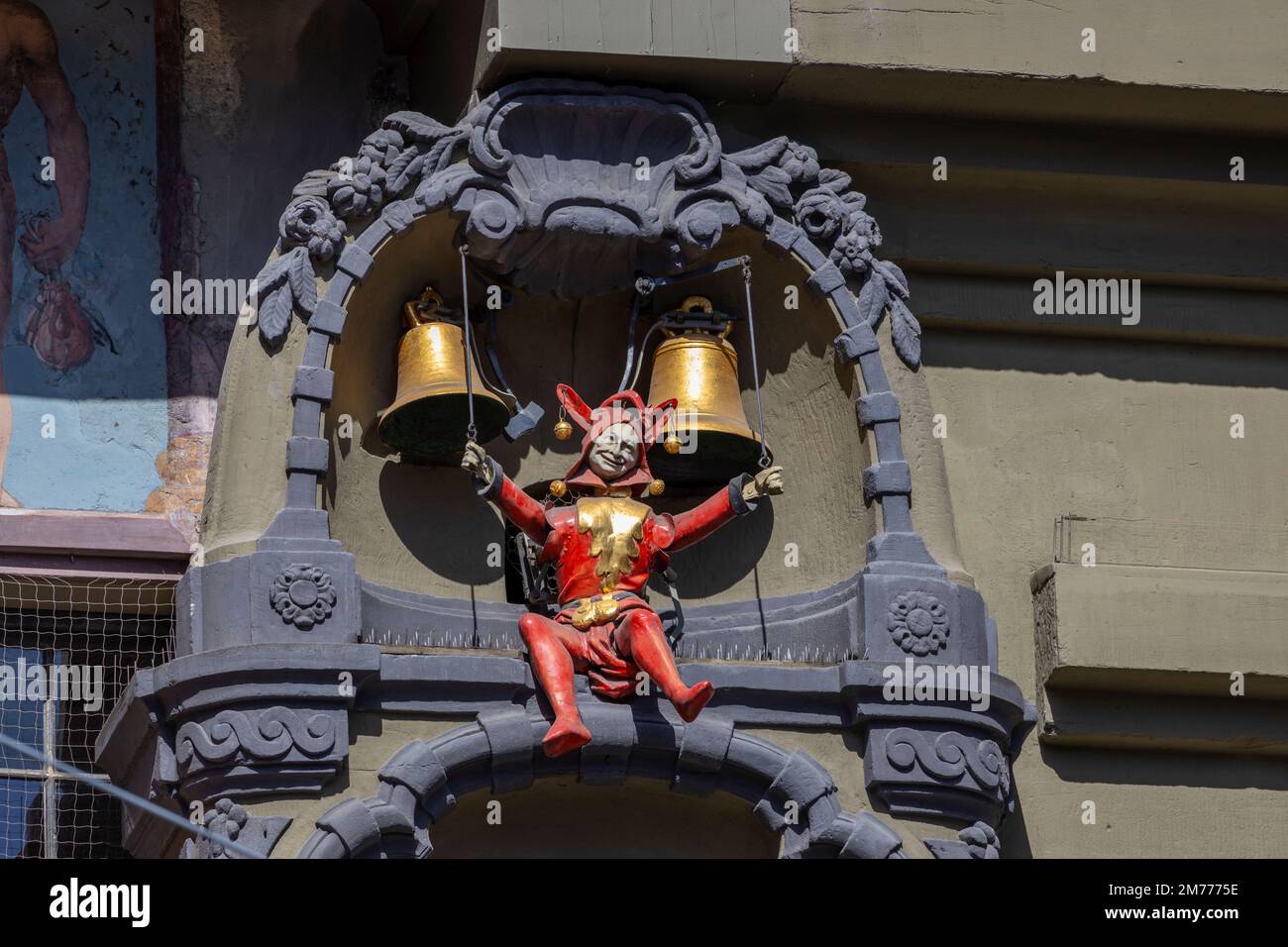 Detail in the Zytglogge clock tower in Bern. The jester dressed in red ...
