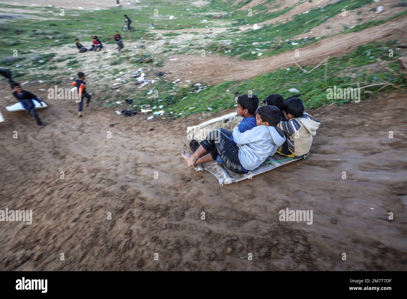 Palestinian children seen playing in front of their house in the ...