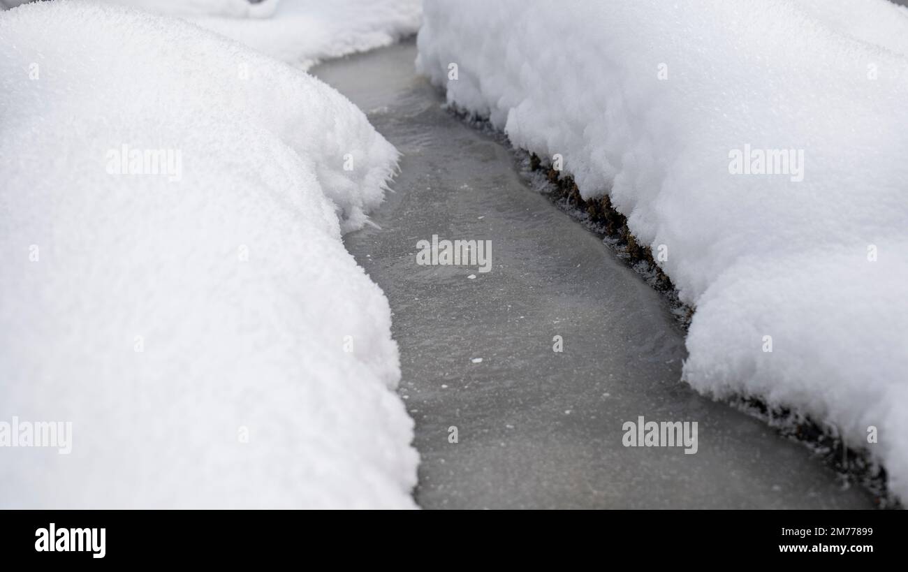 frozen stream close-up. snow and frozen water Stock Photo - Alamy