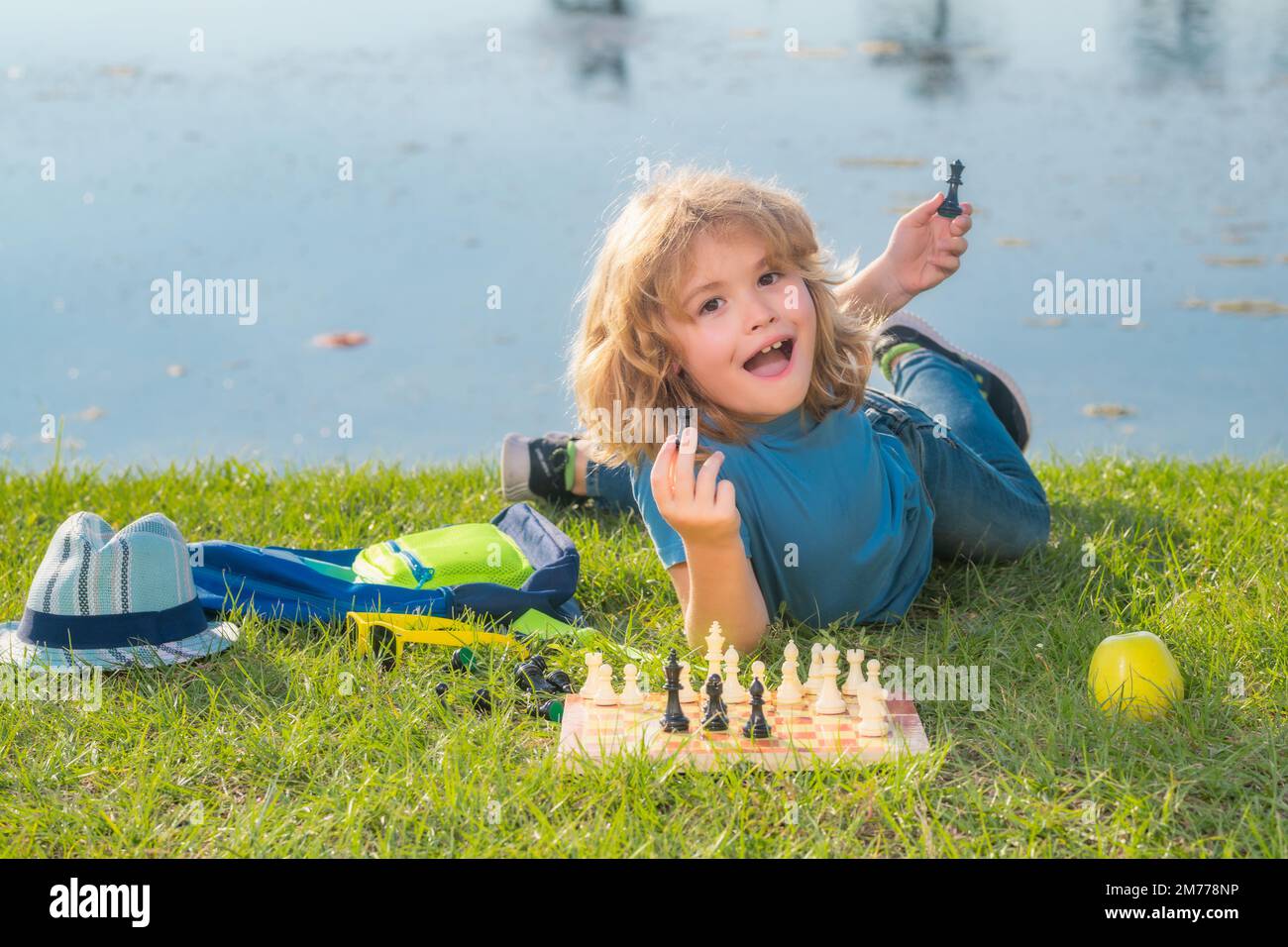 Clever concentrated and thinking child playing chess Stock Photo - Alamy