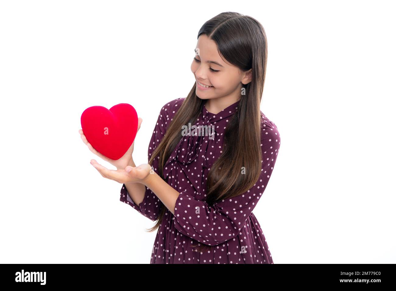Cheerful lovely romantic teen girl hold red heart symbol of love for ...