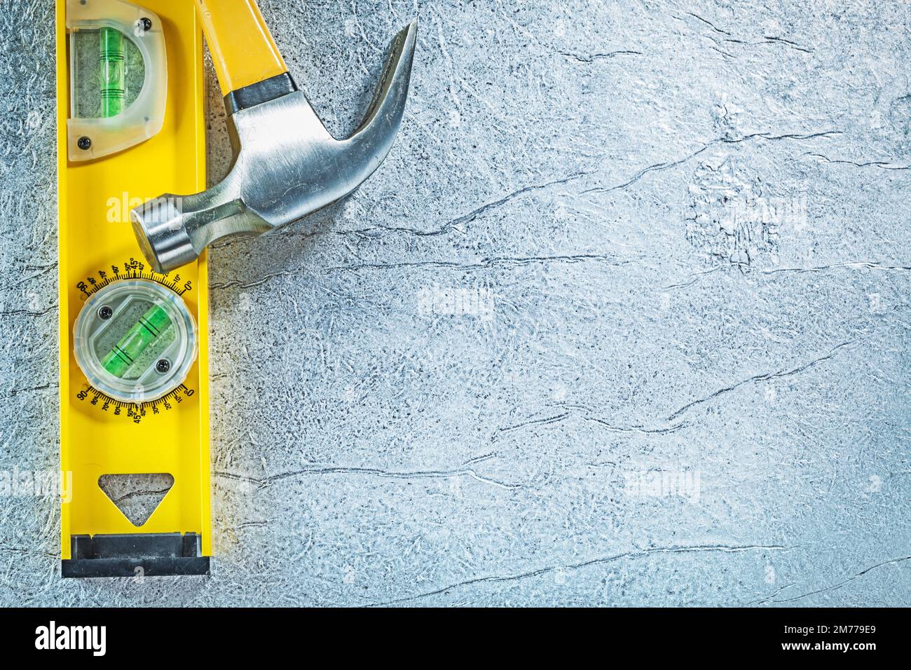 Claw hammer construction level on abstract metallic background building ...