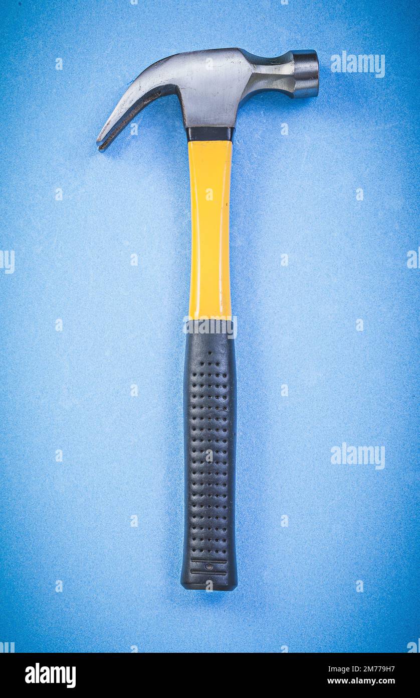 Claw hammer on blue background vertical view construction concept Stock ...