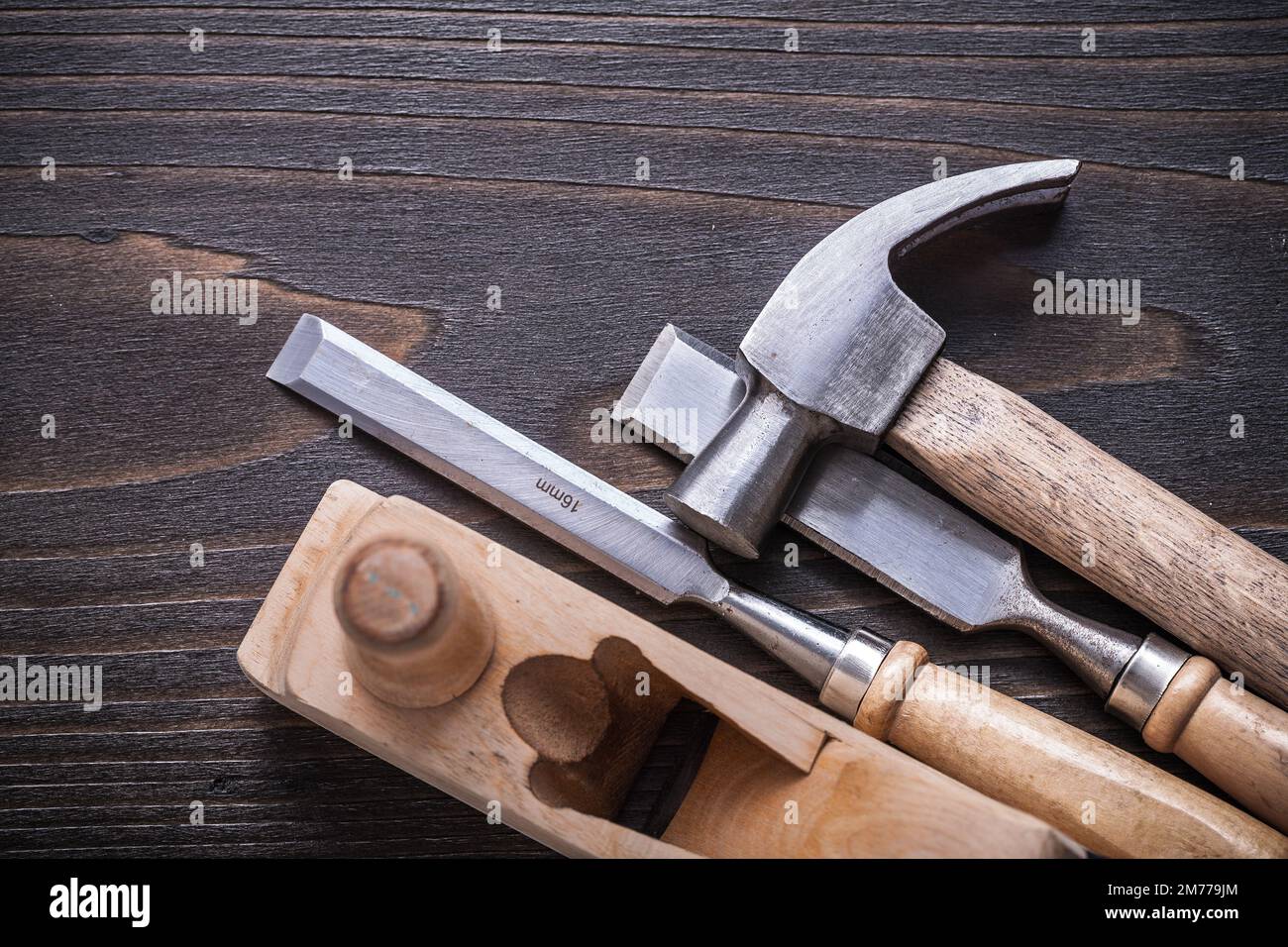 Claw hammer planer and firmer chisels on vintage wooden board ...
