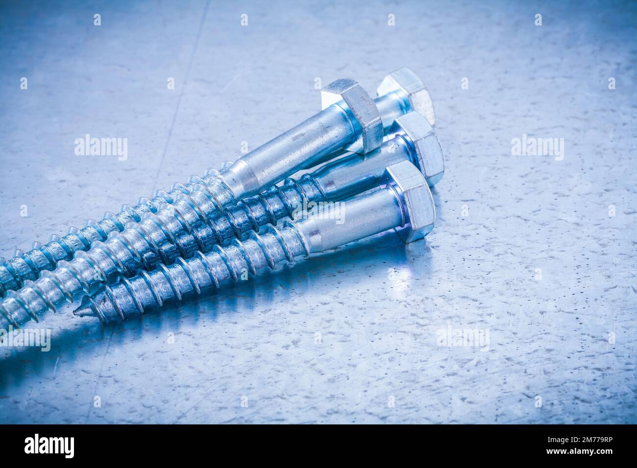 Close up of threaded screw details on metallic background construction ...
