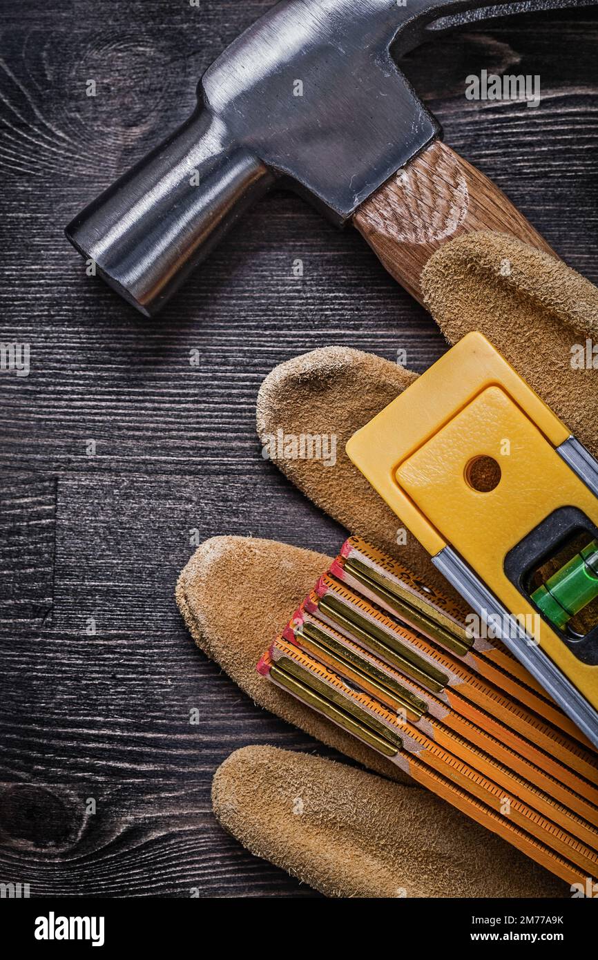 Collection of claw hammer protective gloves wooden meter construction ...