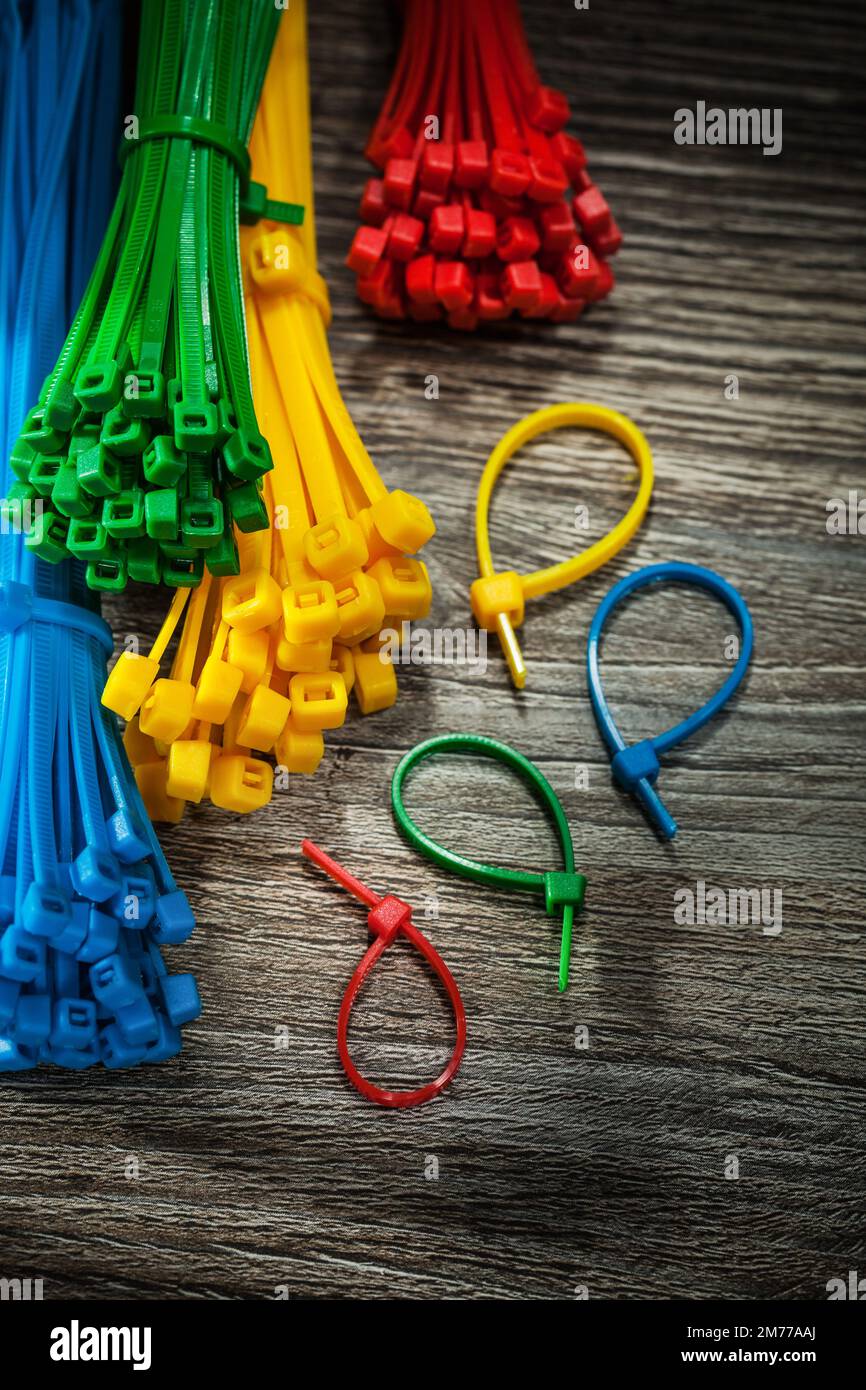 Collection of plastic cables on vintage wooden board Stock Photo - Alamy