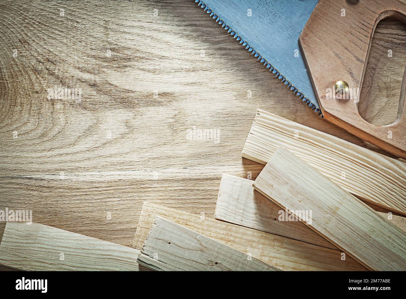 Collection of sharp handsaw wooden planks on wood board construction ...