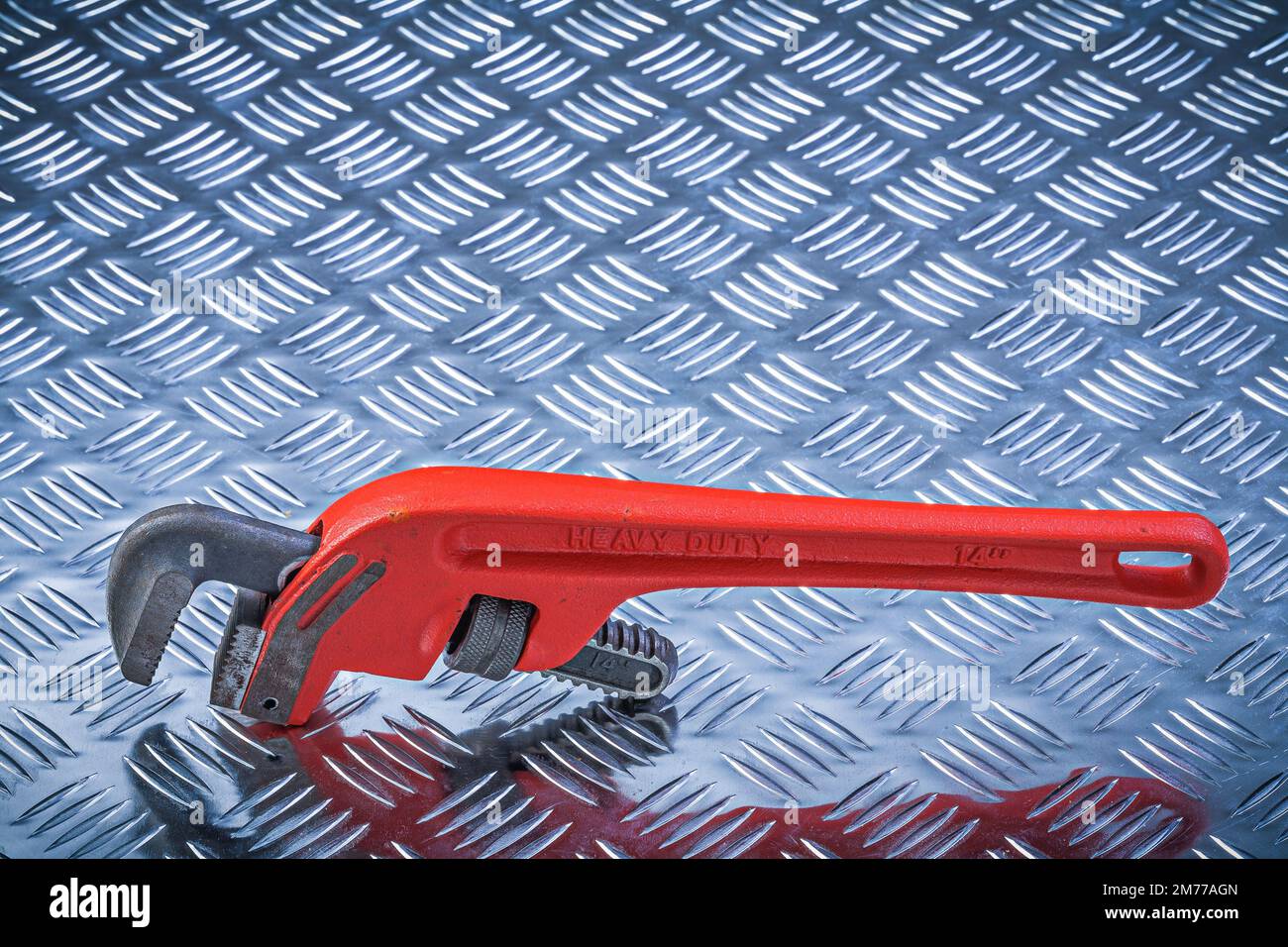 Metal pipe wrench on corrugated metallic plate maintenance concept ...