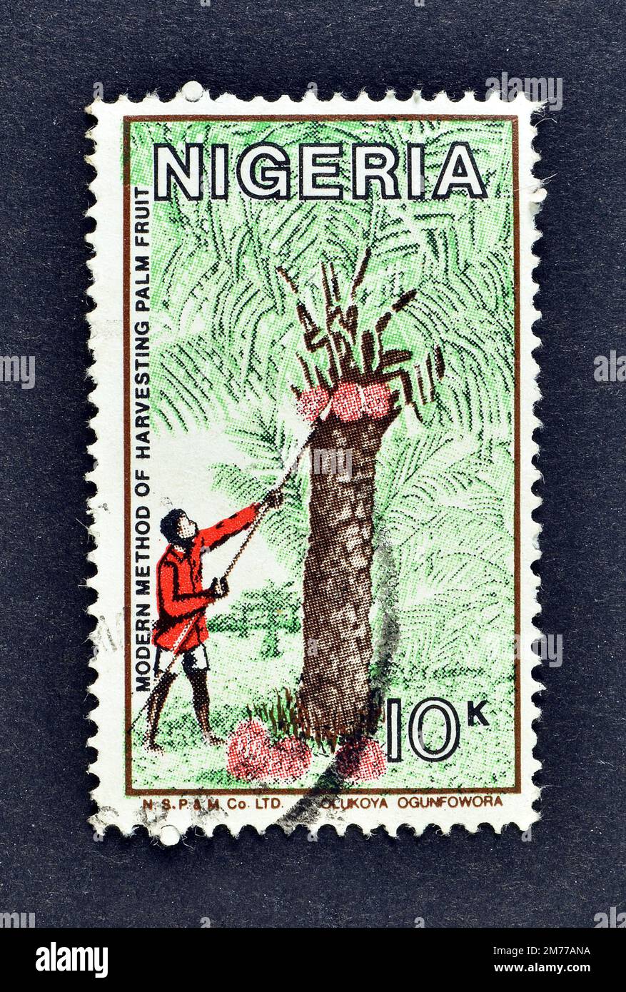 Cancelled postage stamp printed by Nigeria, that shows Coconut harvest ...