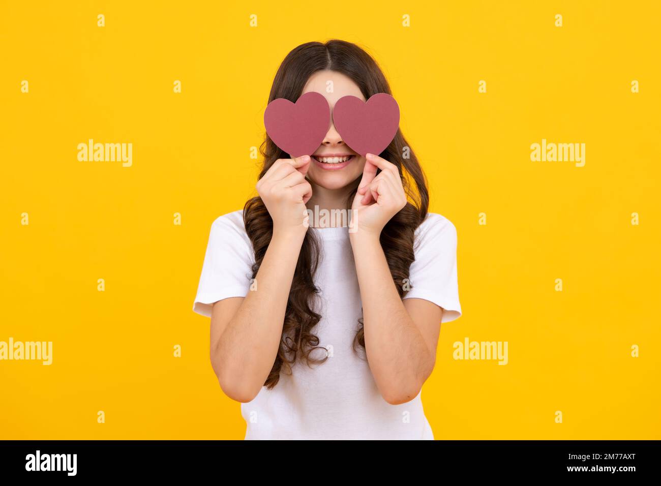 Teenage girl hold shape heart, heart-shape sign. Child holding a red ...