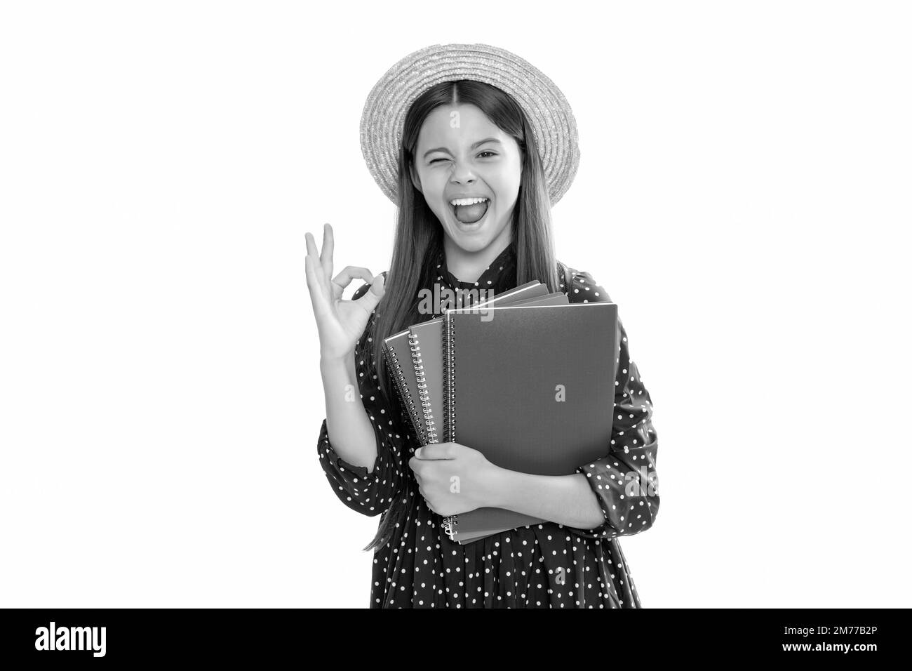 happy winking child hold school copybook for studying isolated on white ...