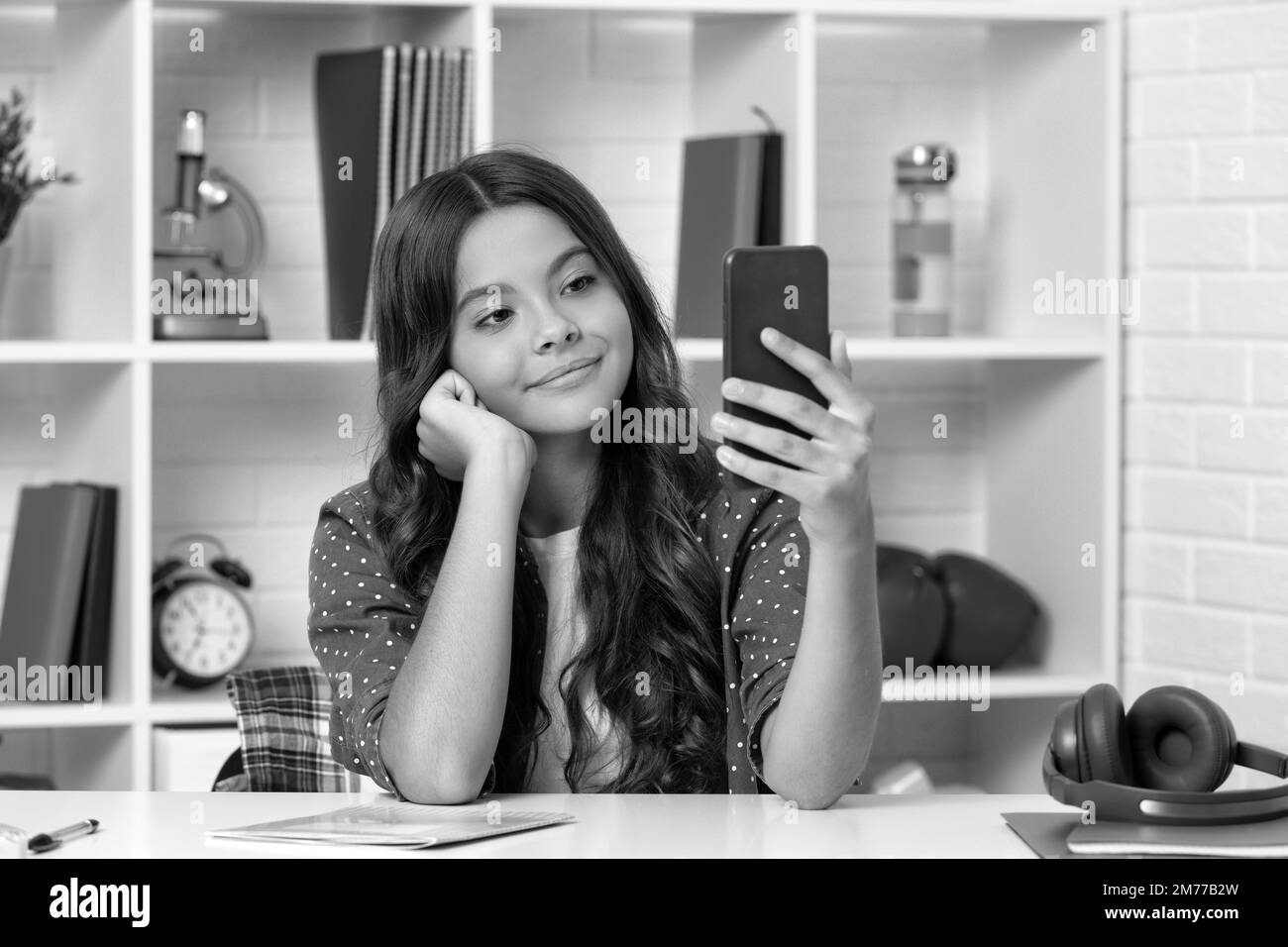 happy kid long curly hair taking selfie photo on smartphone in ...
