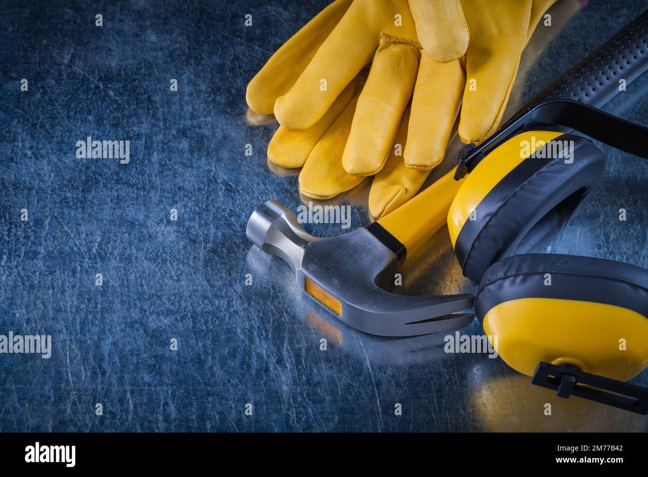 Noise insulation ear muffs claw hammer and leather construction gloves ...