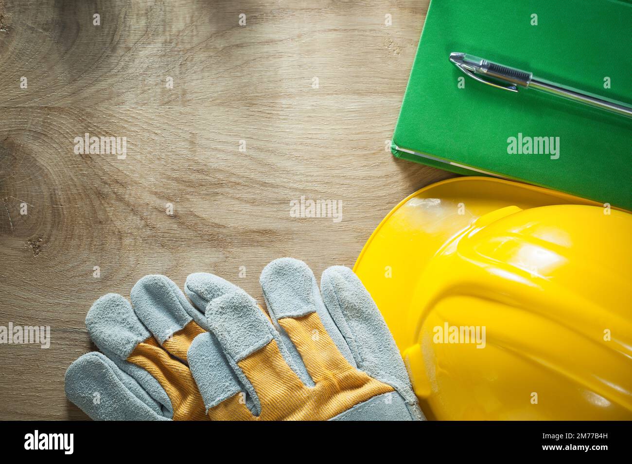 Notepad ballpoint pen protective gloves building helmet Stock Photo - Alamy