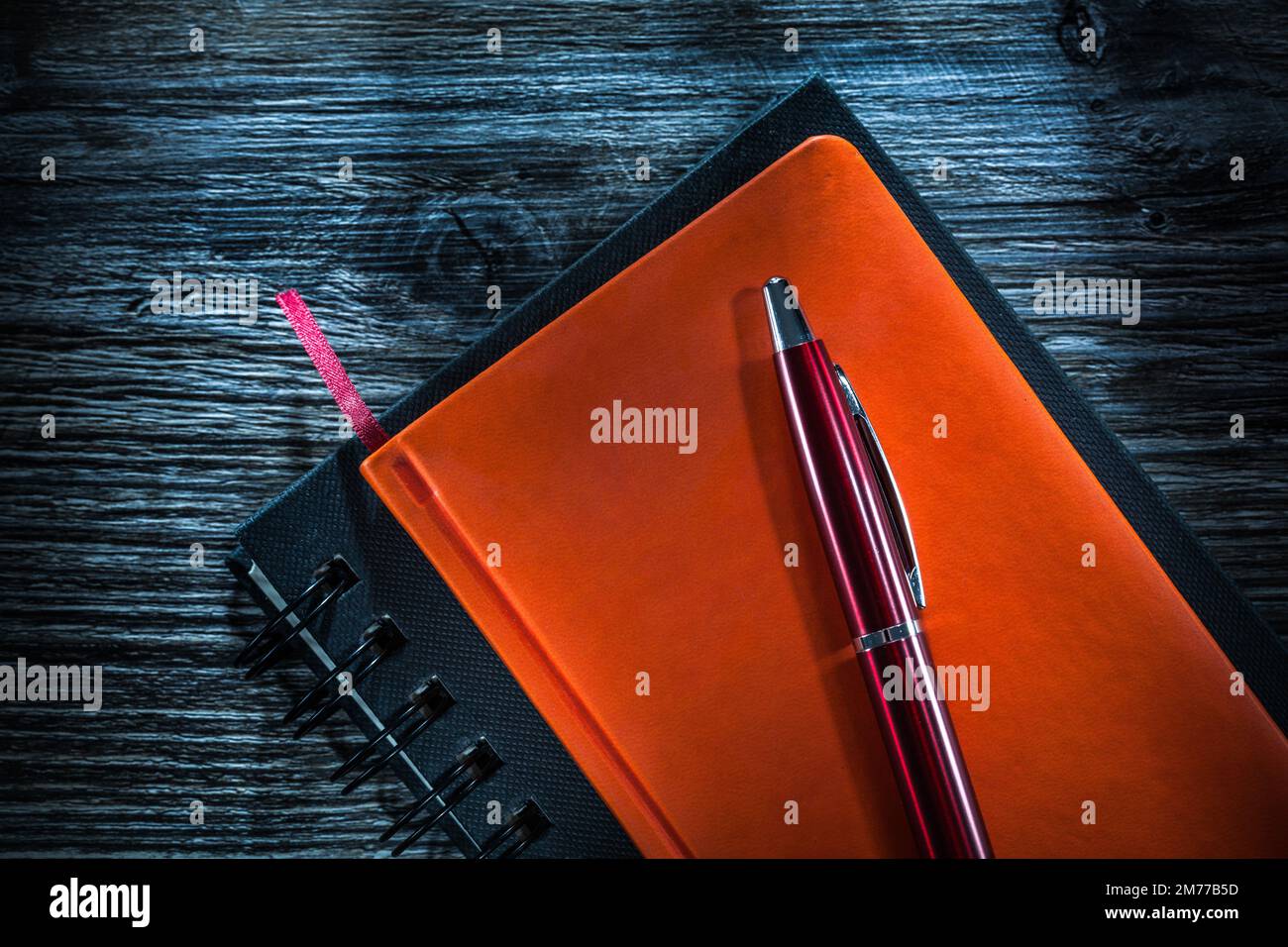 Notepads pen on vintage wooden board horizontal image Stock Photo - Alamy