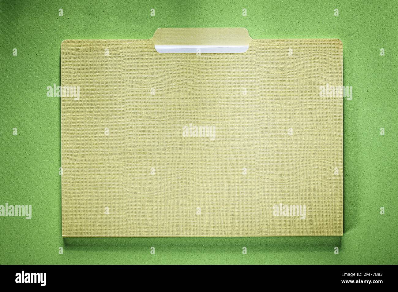 Office folder on green background Stock Photo - Alamy